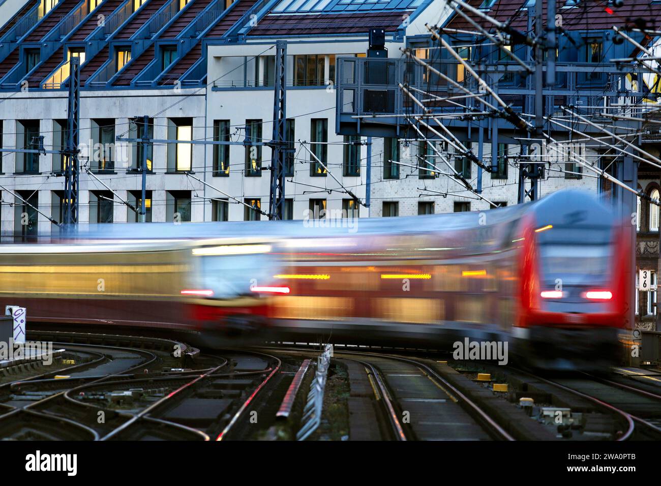 An S-Bahn train and a Deutsche Bahn regional express are photographed ...