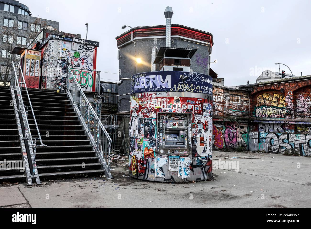 ATM with graffiti and stickers on the RAW site. The RAW site is the ...