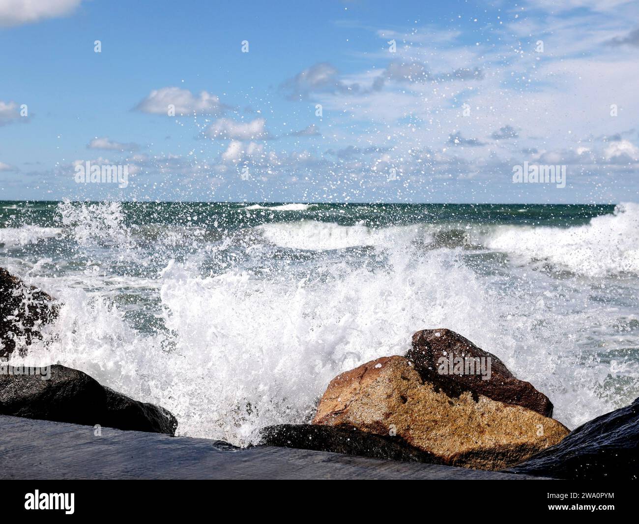 Waves crashing against a seawall, Lonstrup, Denmark, 22 07 2023, Europe ...