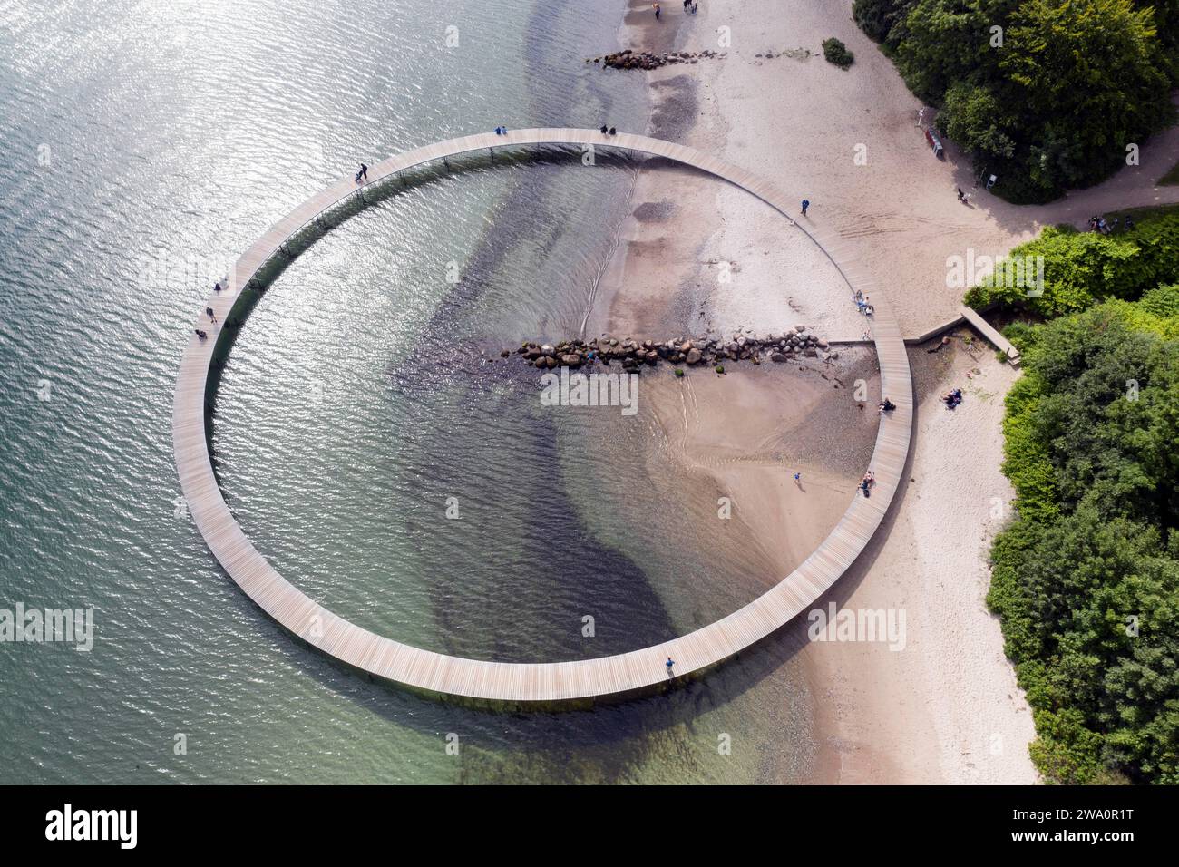 An aerial view shows people walking on the infinite bridge. The bridge ...