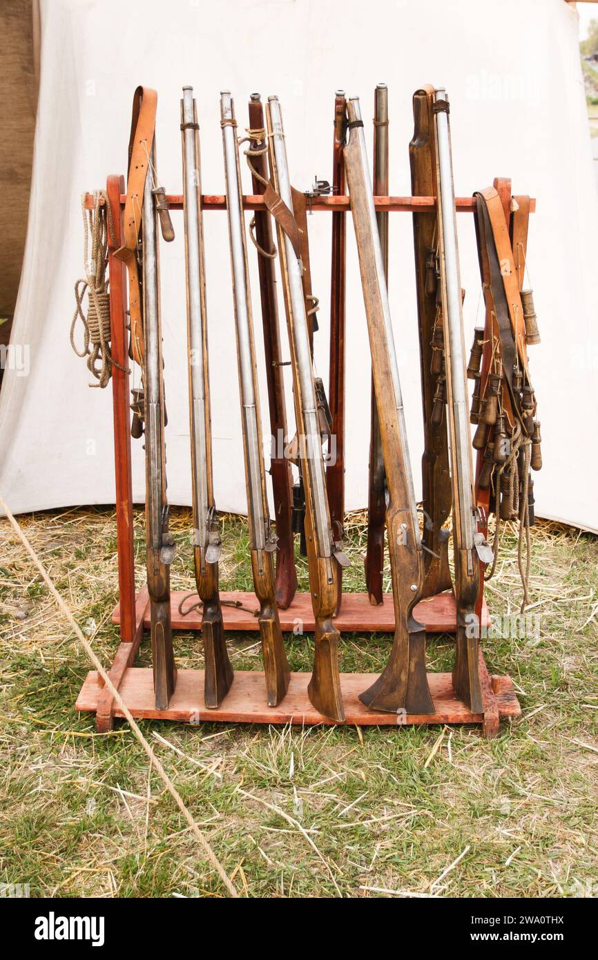 Old vintage muskets standing in the rack at army camp Stock Photo - Alamy