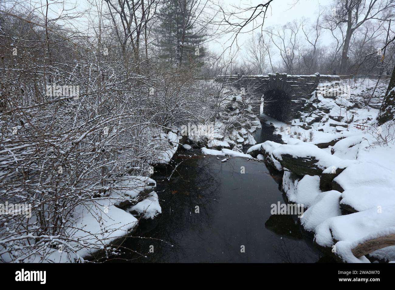 Winter scene picture postcards of Central Park in New York City on a chilly snow day. (Photo ...