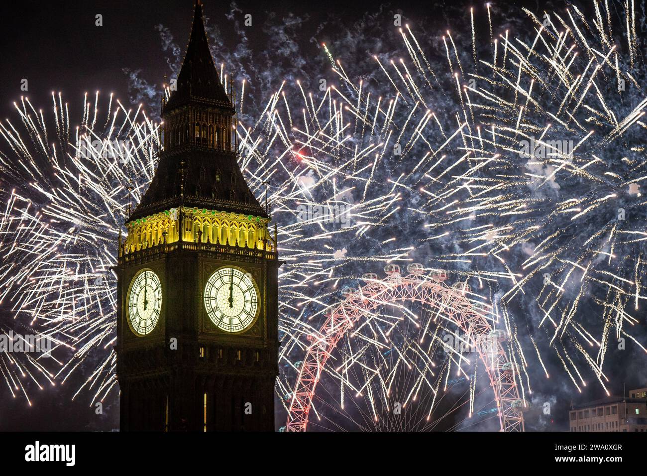Fireworks light up the sky over the London Eye in central London during ...