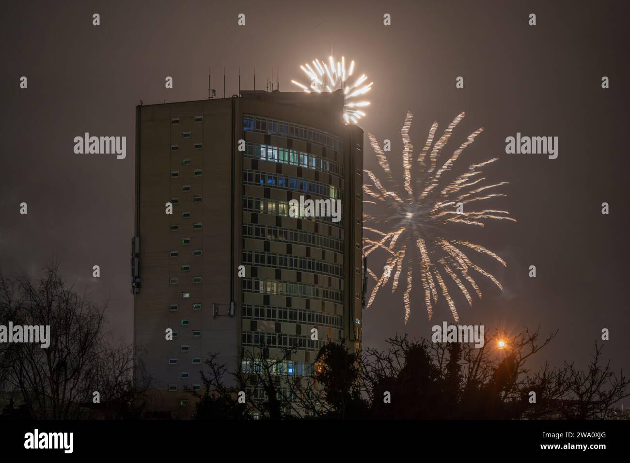 Merton, London, UK. 1st Jan, 2024. New Years Day fireworks burst around ...