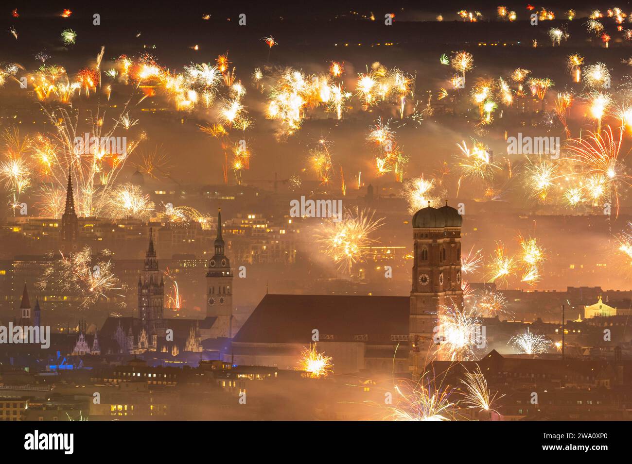 Fireworks light up the sky over Munich, Germany, Monday, Jan. 1, 2024 ...