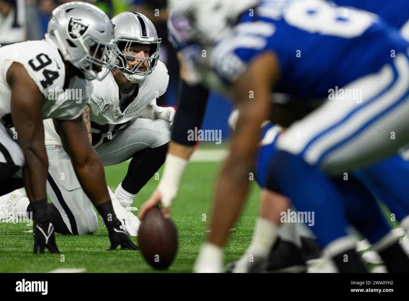 Las Vegas Raiders defensive end Maxx Crosby (98) looks across into the ...