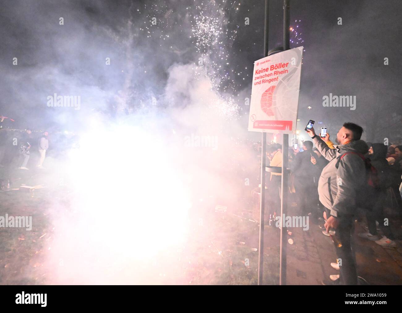 Cologne, Germany. 01st Jan, 2024. People set off fireworks in the old ...