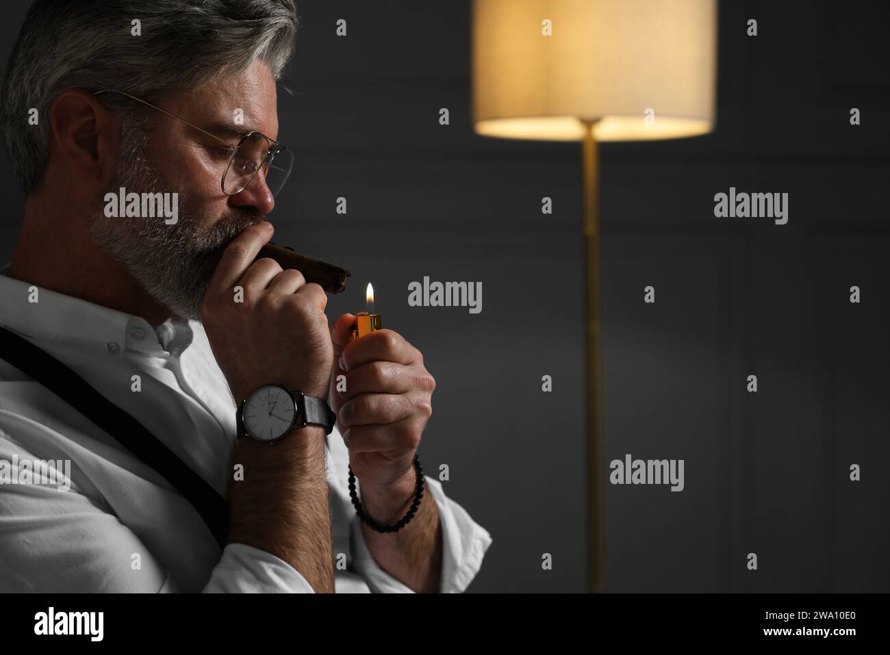 Man lighting cigar hi-res stock photography and images - Alamy