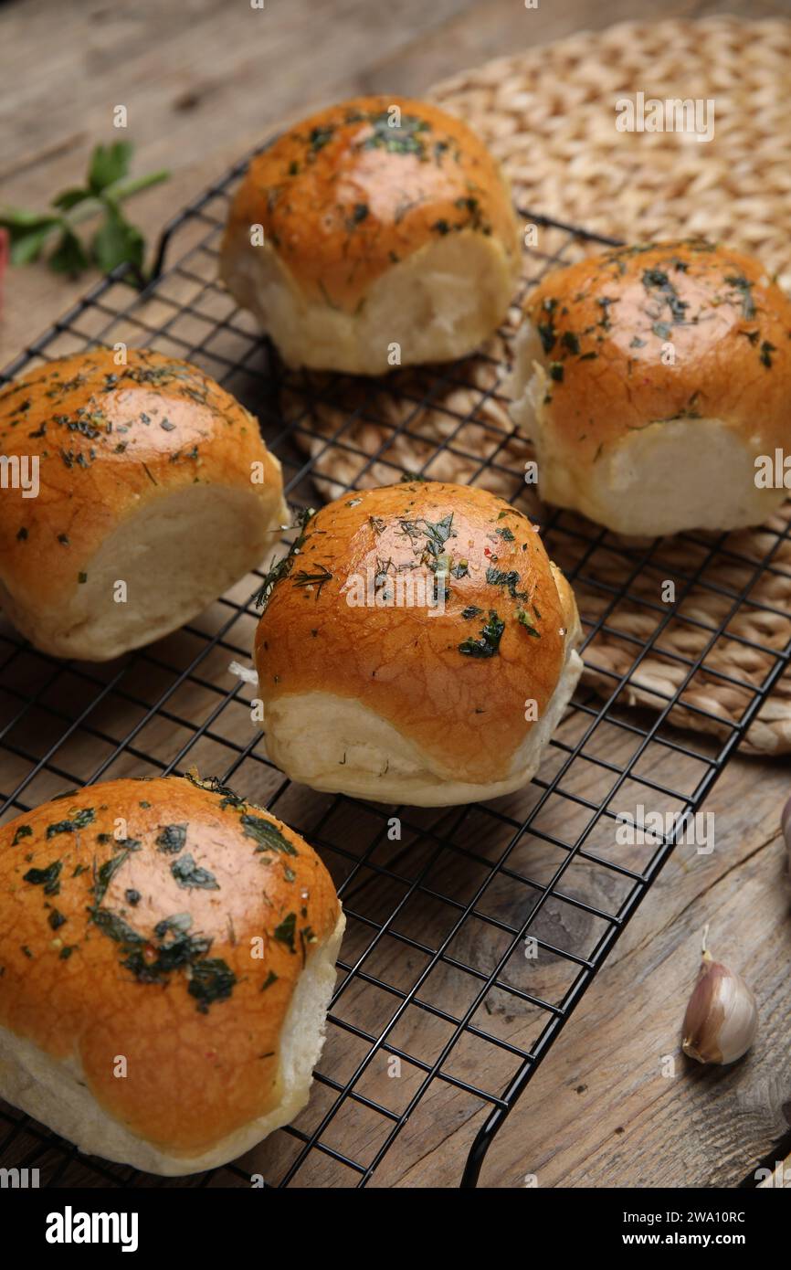 Traditional Ukrainian bread (Pampushky) with garlic on wooden table ...