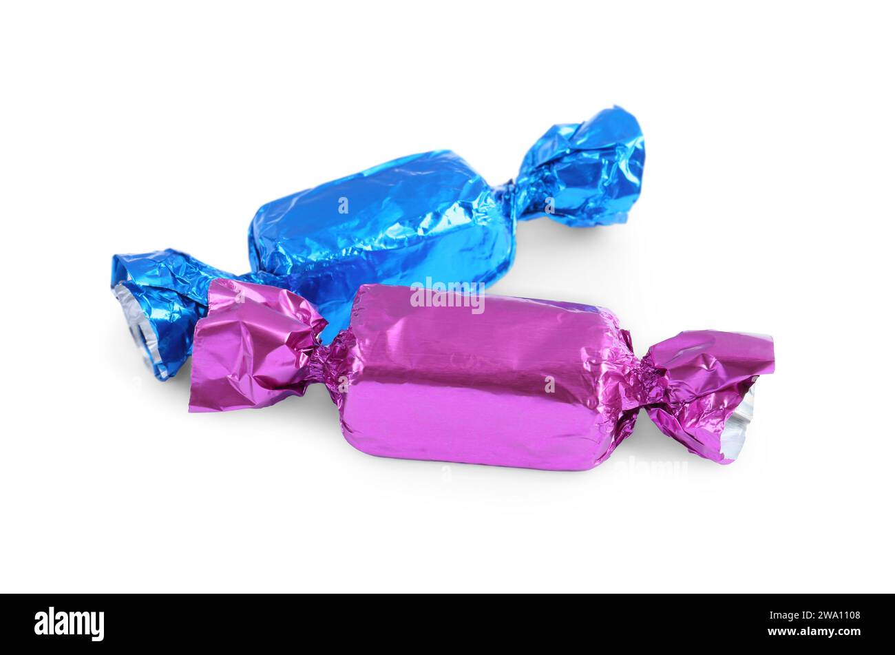 Two candies in colorful wrappers isolated on white Stock Photo - Alamy