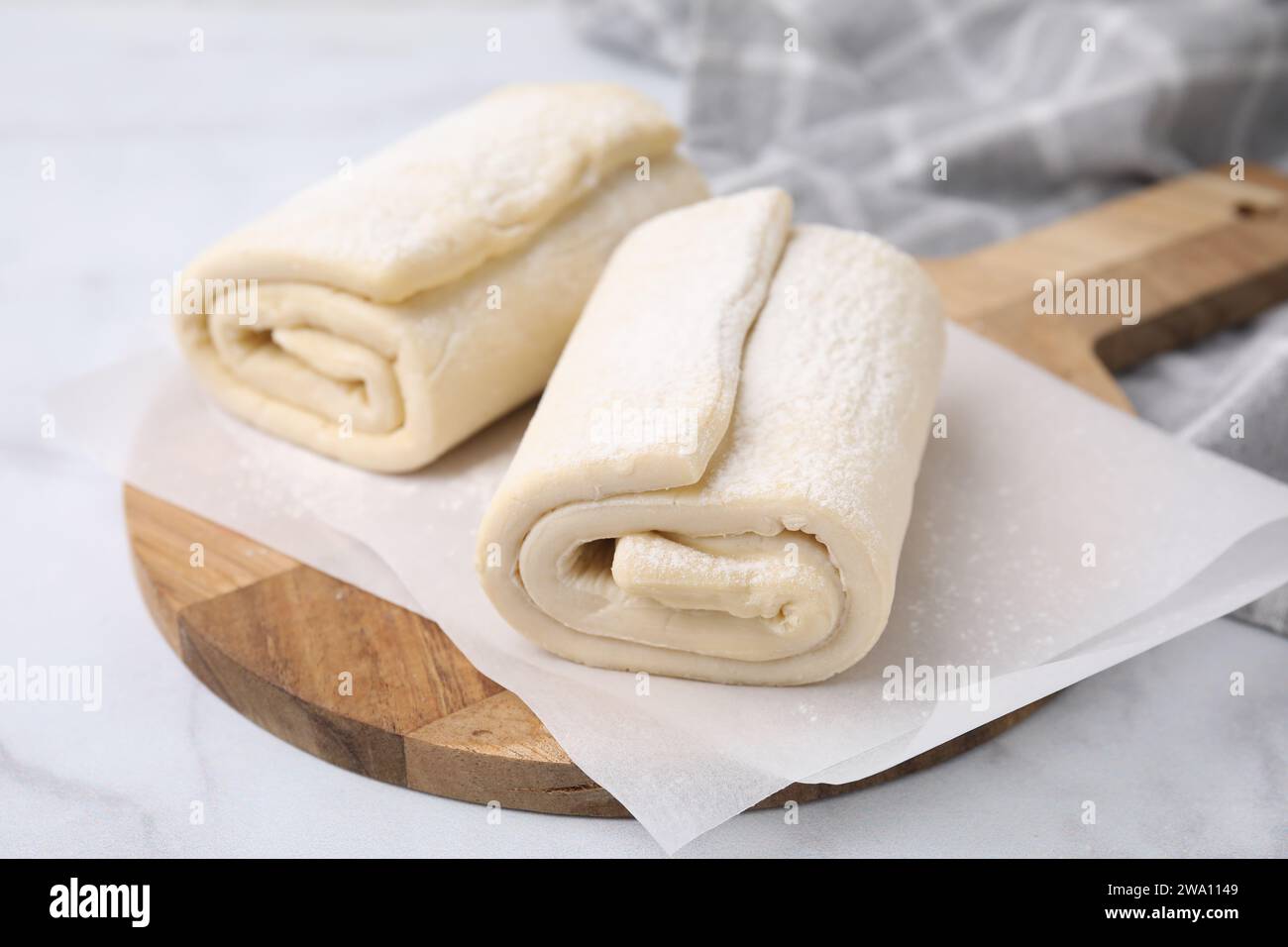 Raw puff pastry dough on white marble table, closeup Stock Photo - Alamy
