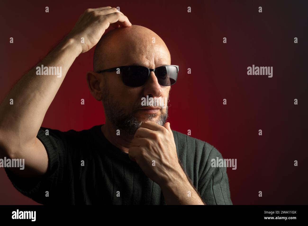 Caucasian man, bald, wearing sunglasses, confidently serious with his ...