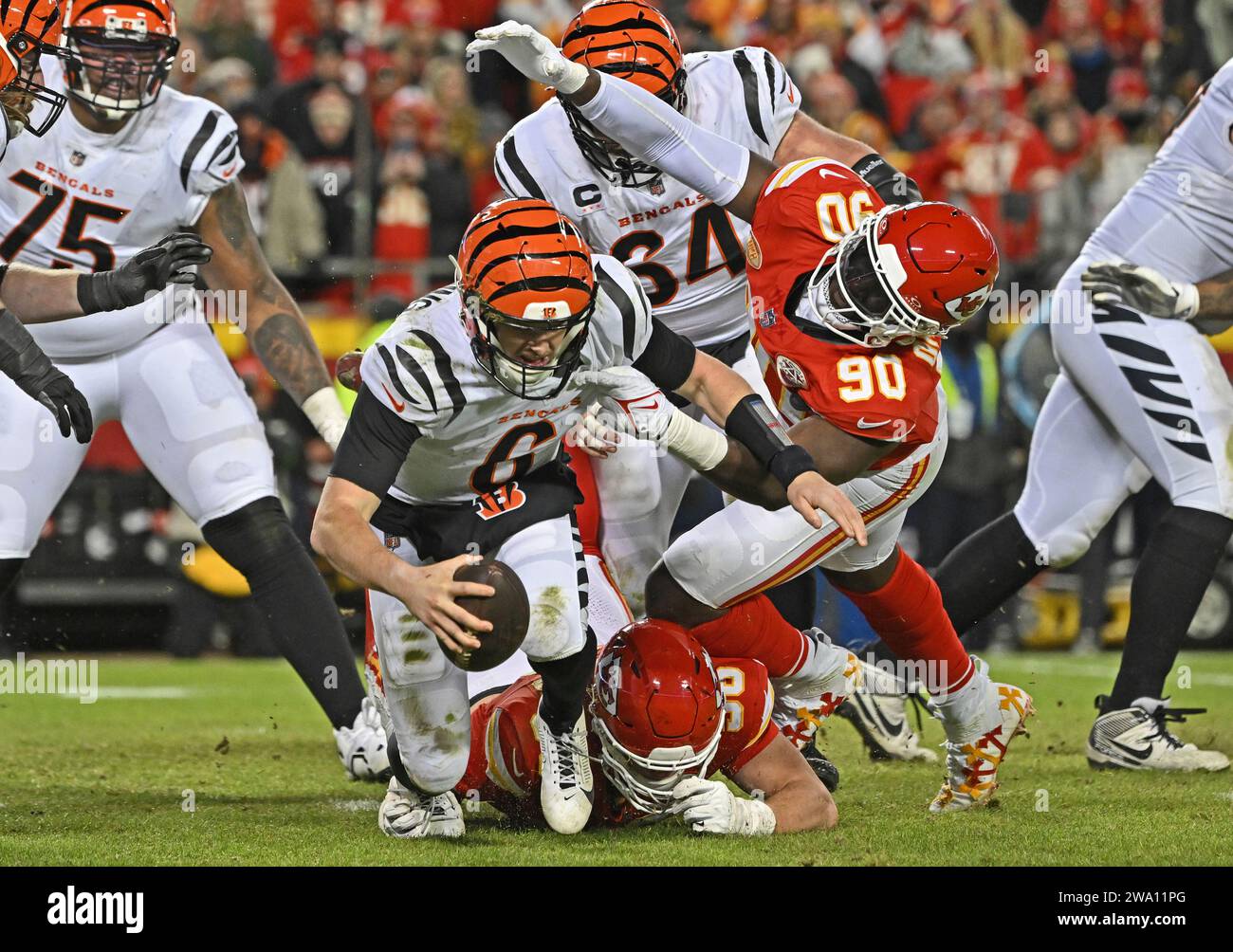 Kansas City Chiefs defensive end Charles Omenihu (90) reaches in to ...