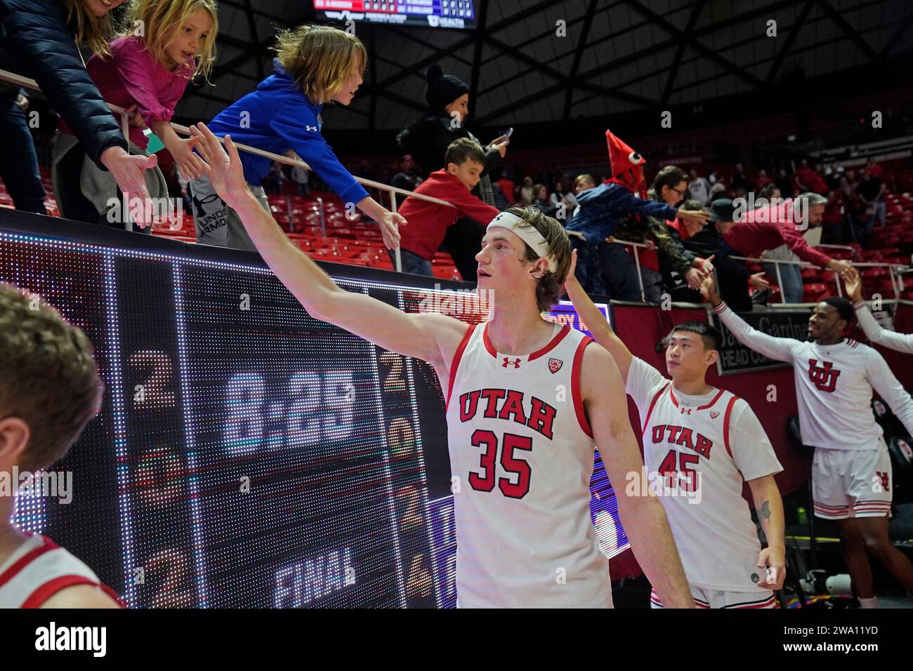 Utah center Branden Carlson (35) celebrates with fans following their ...