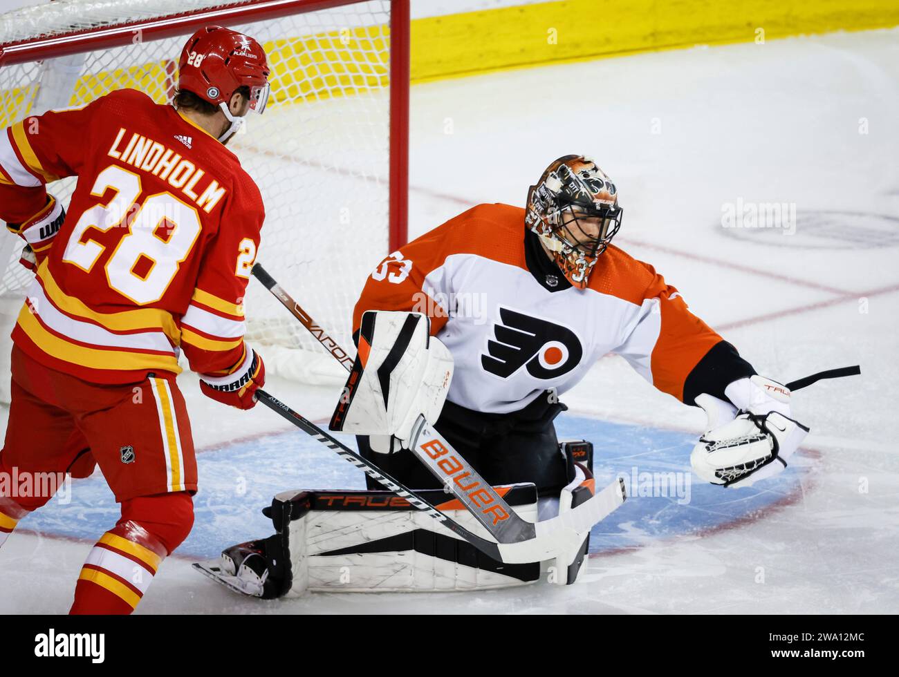 Philadelphia Flyers goalie Samuel Ersso, right, grabs a shot from ...