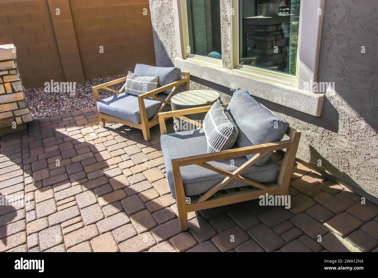 Two Arm Chairs On Front Pavers Porch Stock Photo - Alamy