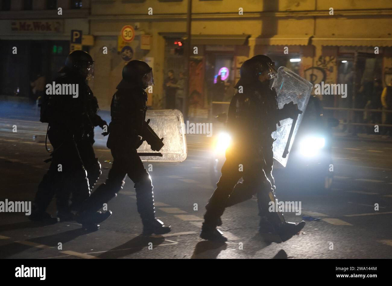Leipzig, Germany. 01st Jan, 2024. Police officers walk along ...