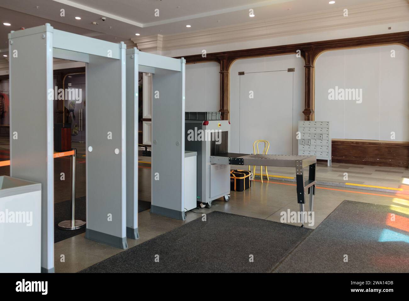 X-ray scanner and metal detector at security point. Security gates with ...