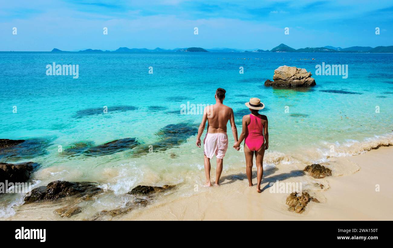 A couple of European men and Asian woman on a boat trip at Ko Kham ...