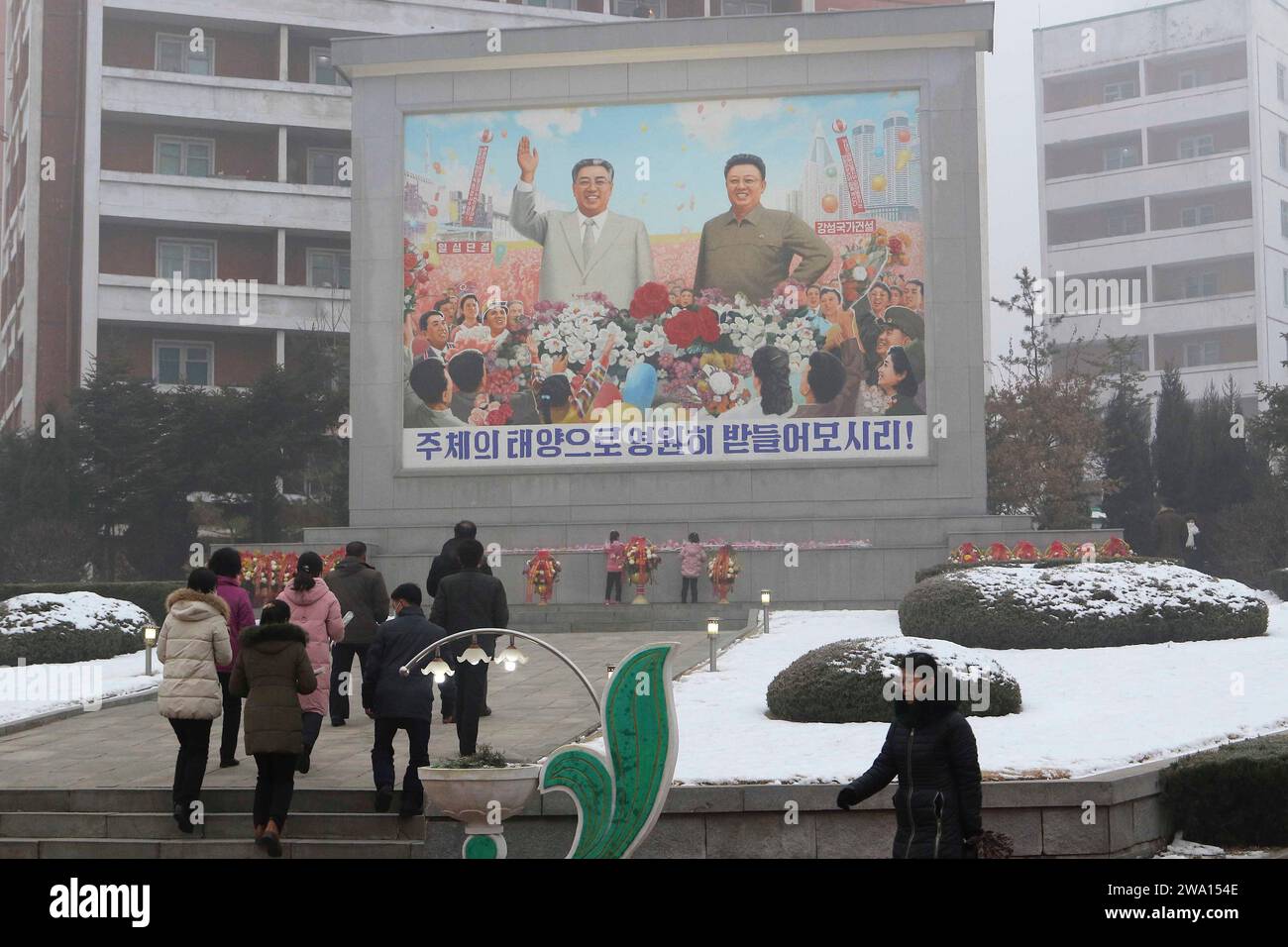 Pyongyang citizens pay respect to mosaics depicting smiling images of ...
