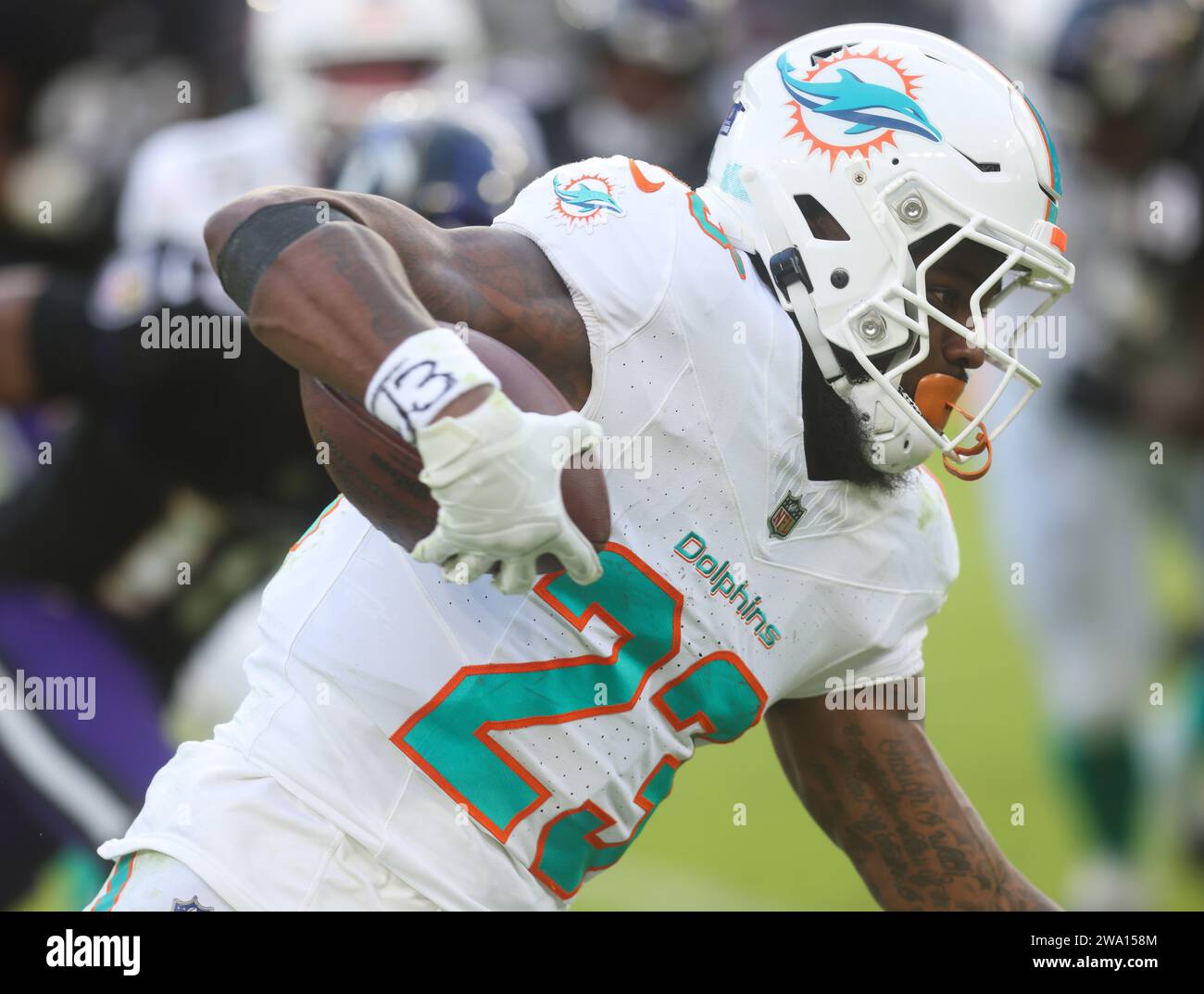 December 31, 2023: Miami Dolphins RB Jeff Wilson Jr. (23) in action against the Baltimore Ravens ...