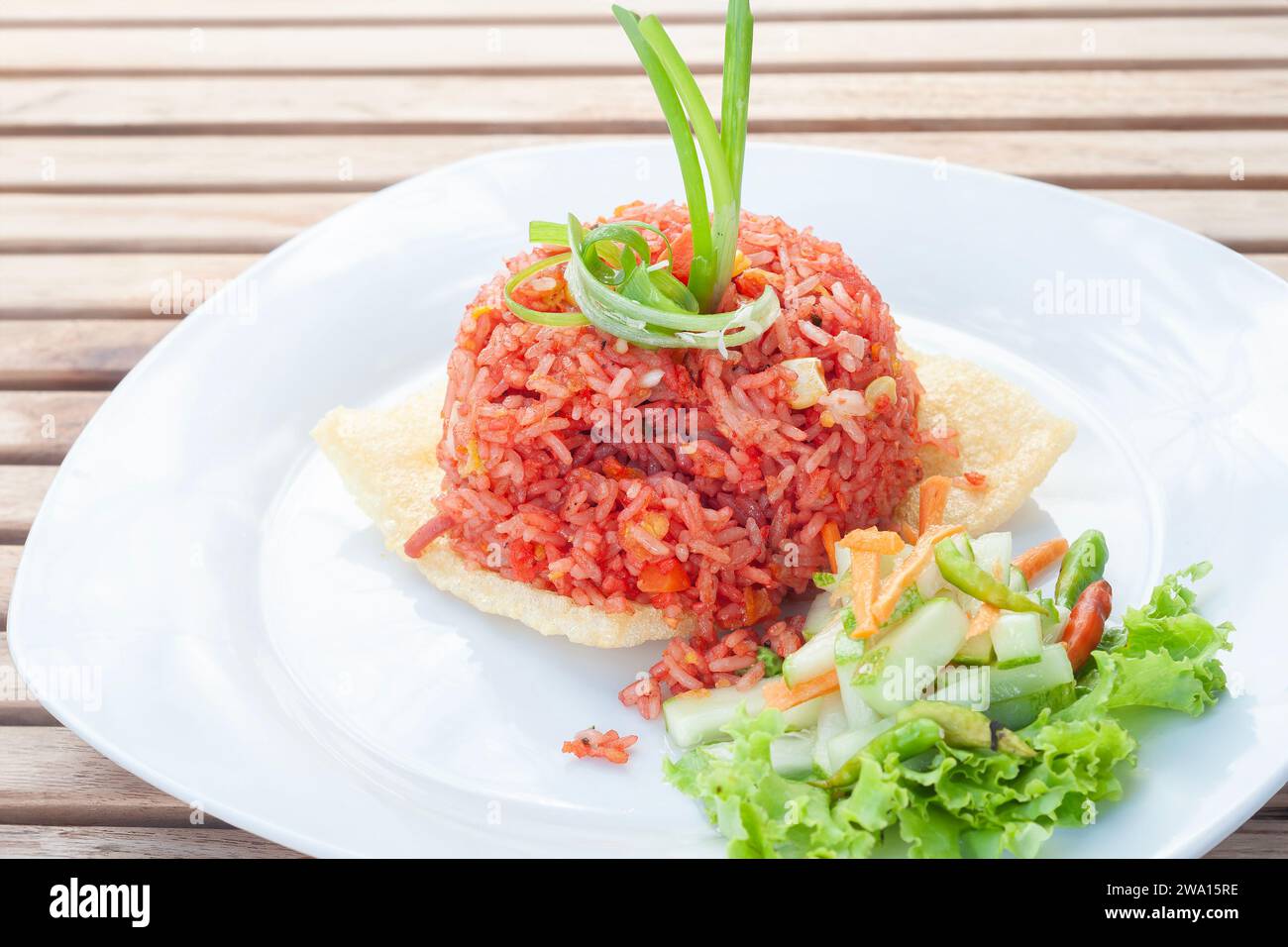 Red Fried Rice is made from rice fried with spicy spices and garnished ...