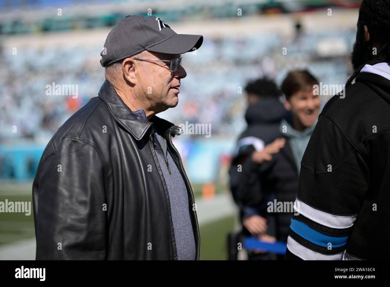 Carolina Panthers owner David Tepper, left, leaves the field after ...