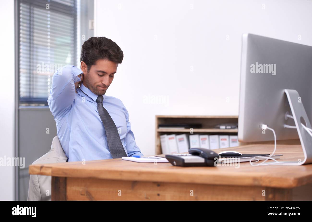 Business man, burnout and fatigue at work with paralegal in office ...