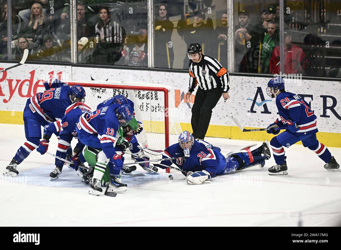 U.S. National U-18 team Nick Kempf (31) dives to cover a loose puck ...