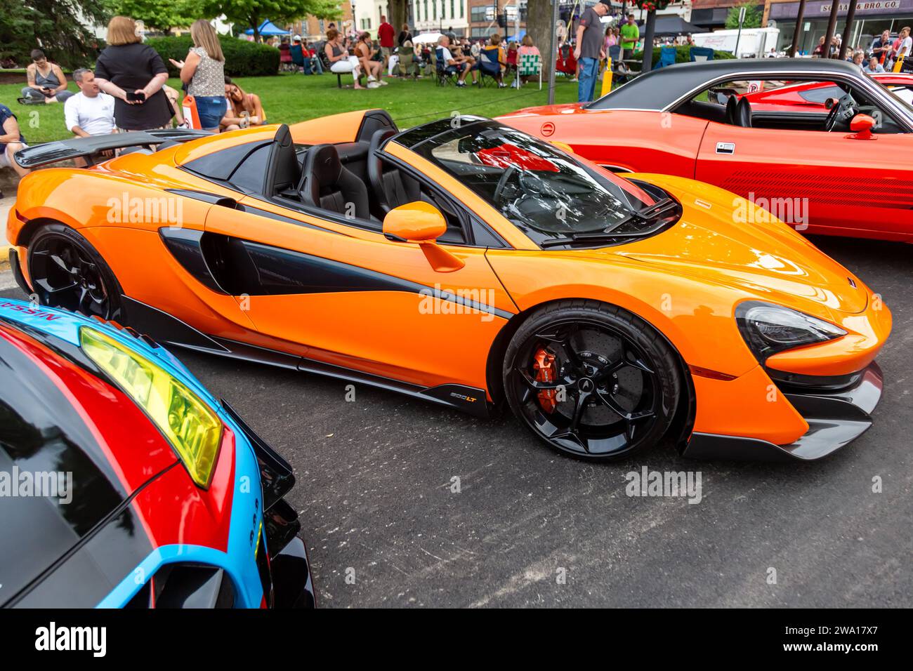 This yellow McLaren 570S Spider convertible sports car is on display as ...