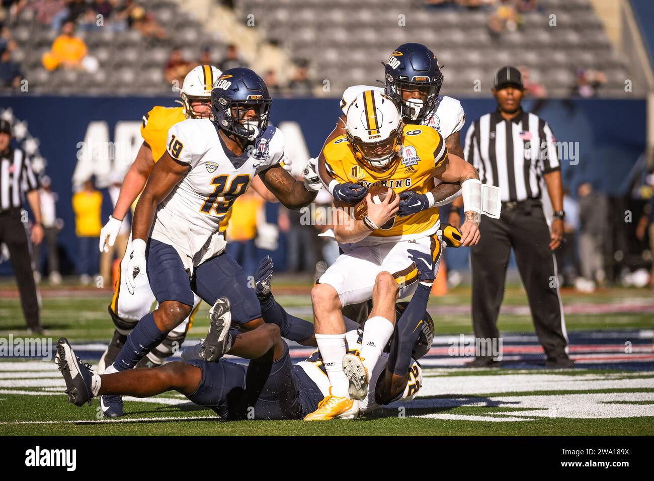 Wyoming Cowboys quarterback Andrew Peasley (6) gets tackled for a first ...
