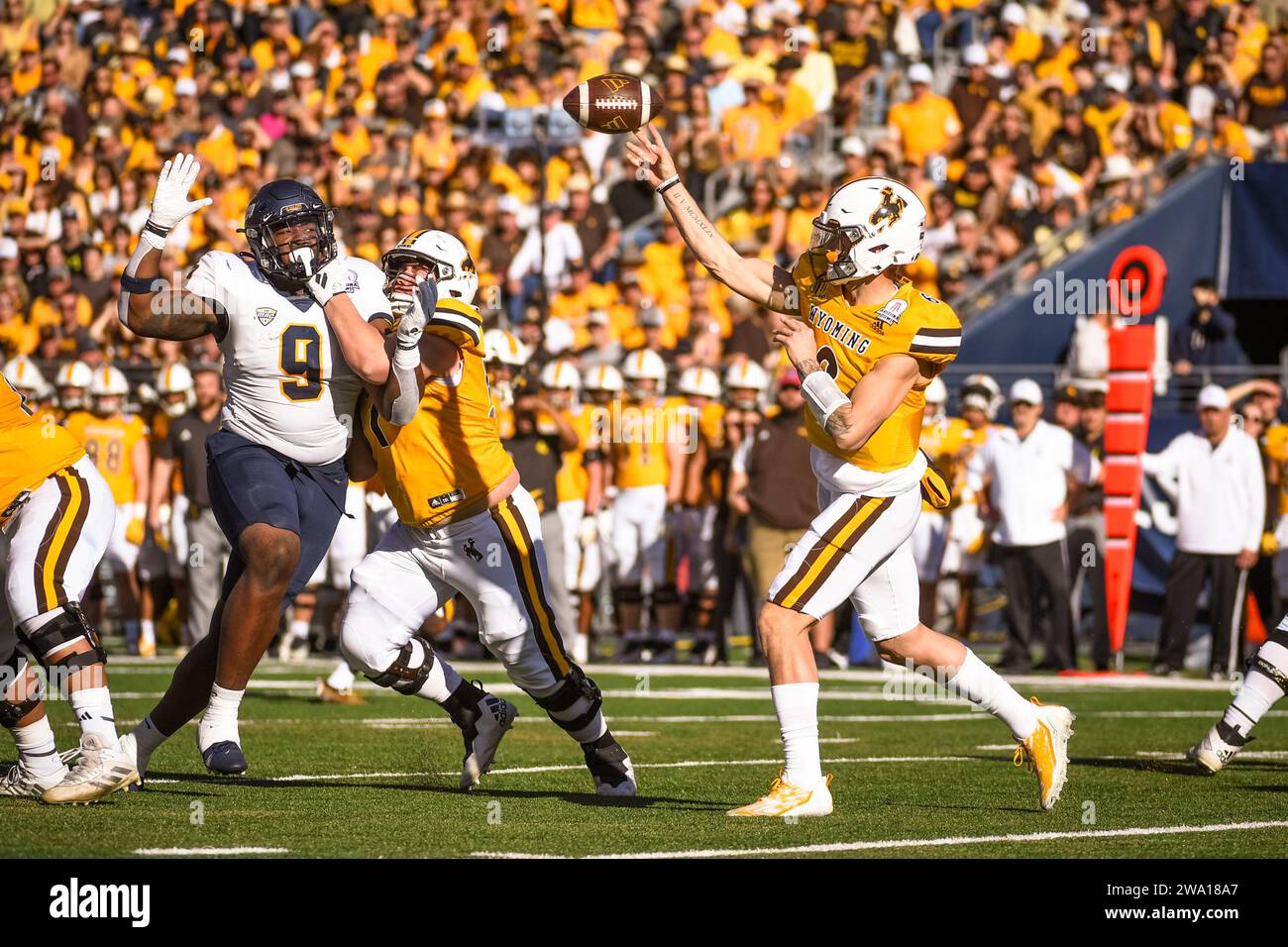 Wyoming Cowboys quarterback Andrew Peasley (6) throws down field in the ...