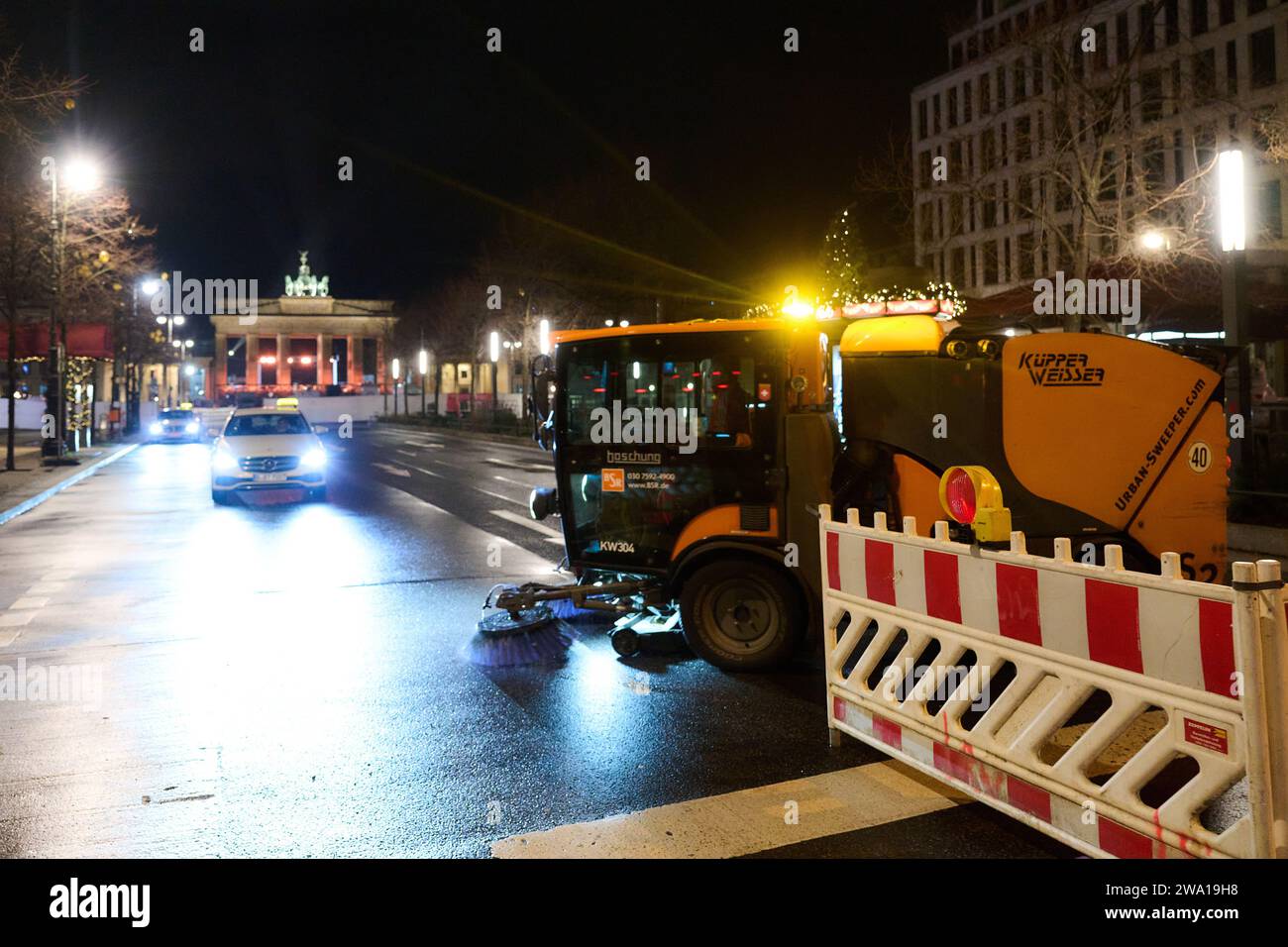 Berlin, Germany. 01st Jan, 2024. A BSR city cleaning vehicle cleans ...
