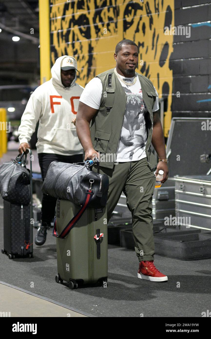 Carolina Panthers guard Gabe Jackson, front, arrives to the stadium ...