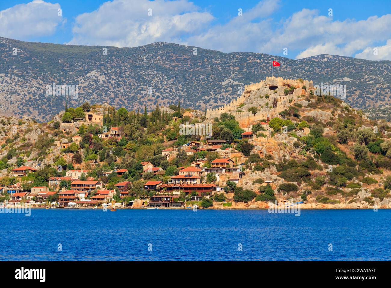 View of ancient Lycian town Simena with fortress on a mount on the ...