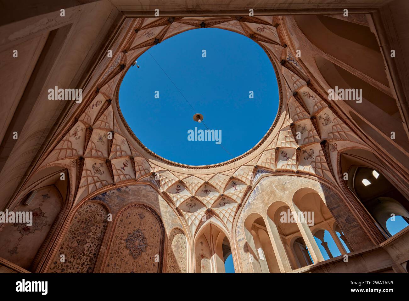 Domed ceiling with open round skylight in one of the halls of the ...