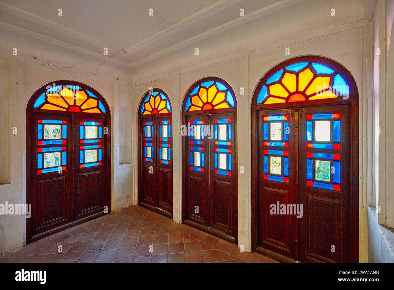 Old wooden doors with colorful stained glass windows in one of the ...