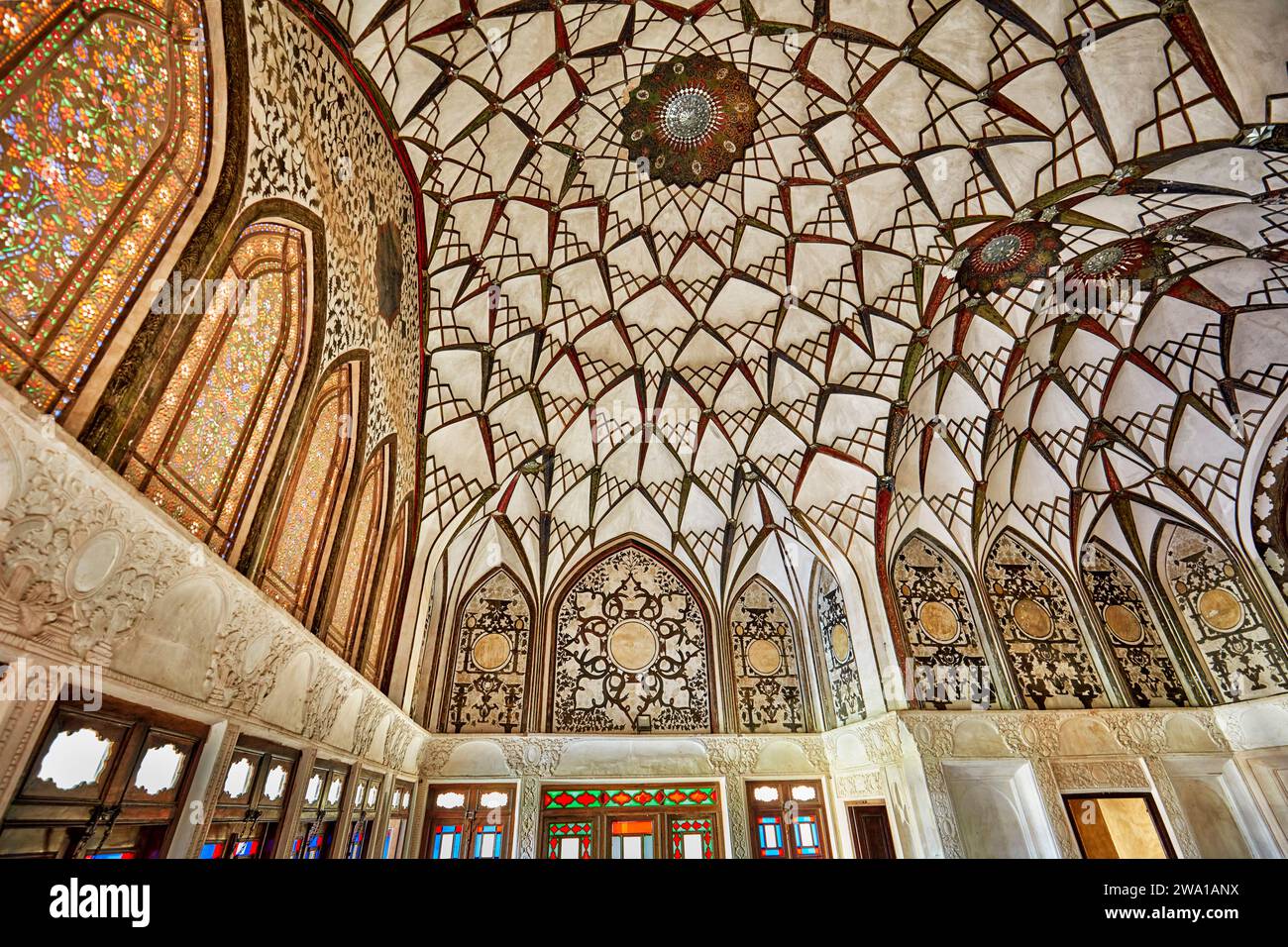 Richly decorated domed ceiling of the main hall in Borujerdi House ...