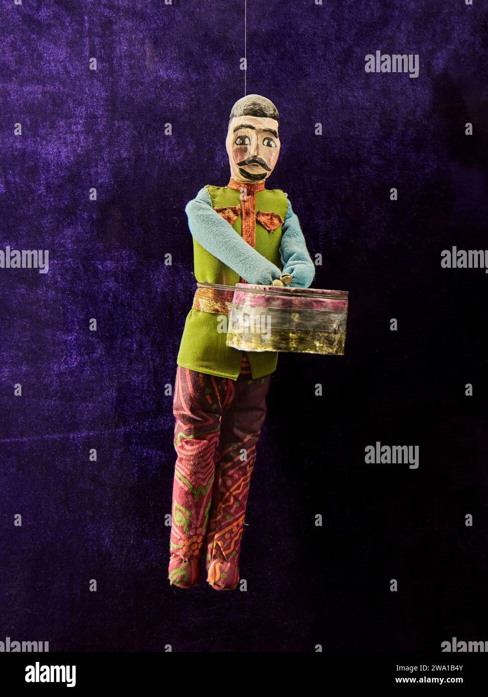 The 19th century Persian marionette representing a musician with a drum ...