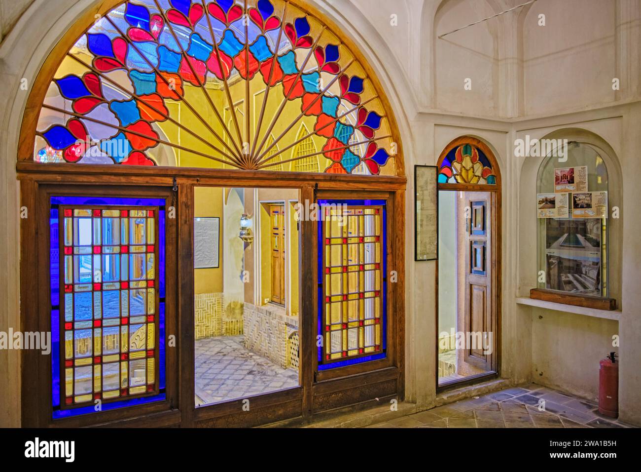 Room with colorful stained glass windows in the Taj House, historic ...
