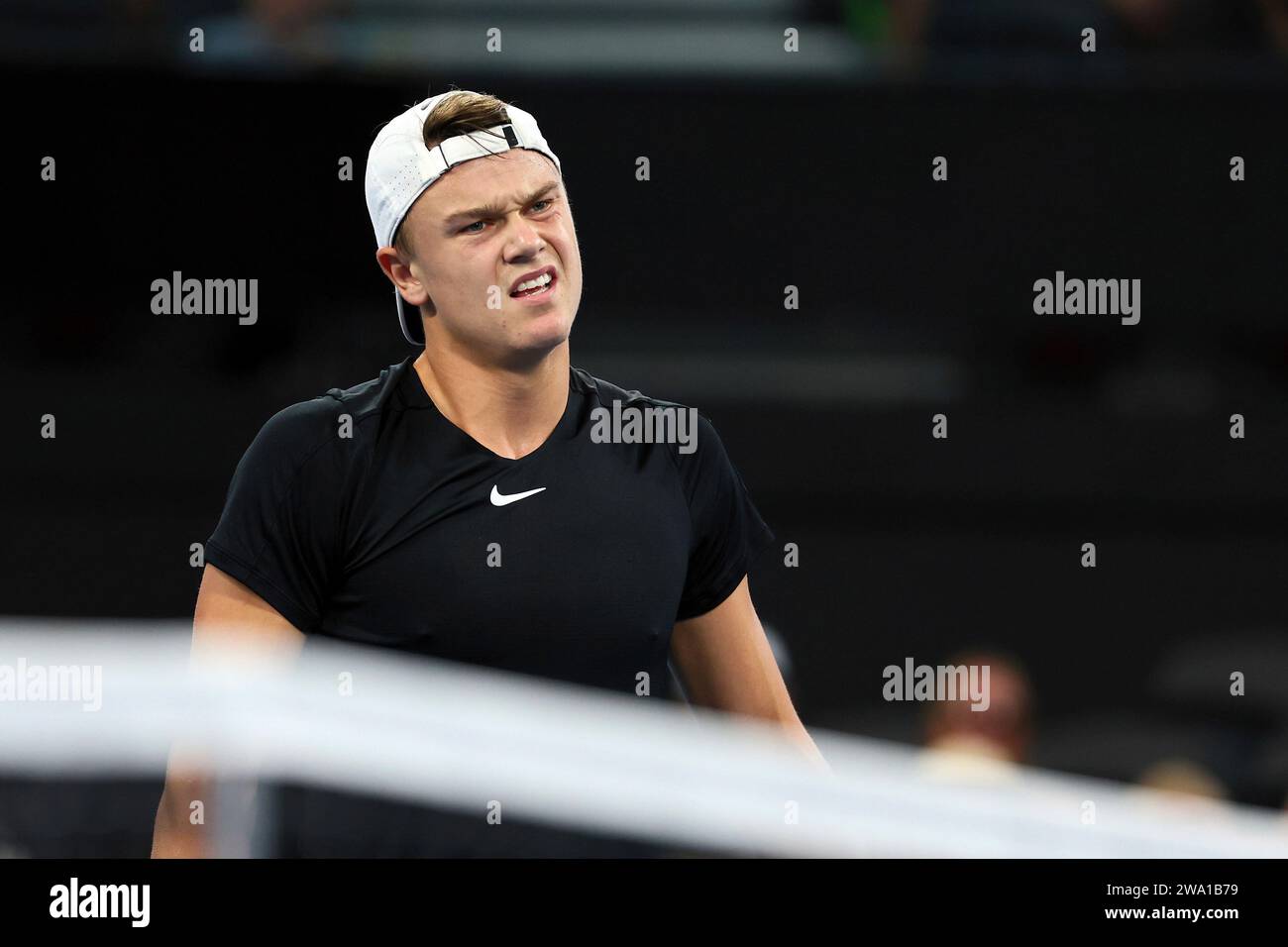 Holger Rune of Denmark reacts after missing a shot in his match against ...