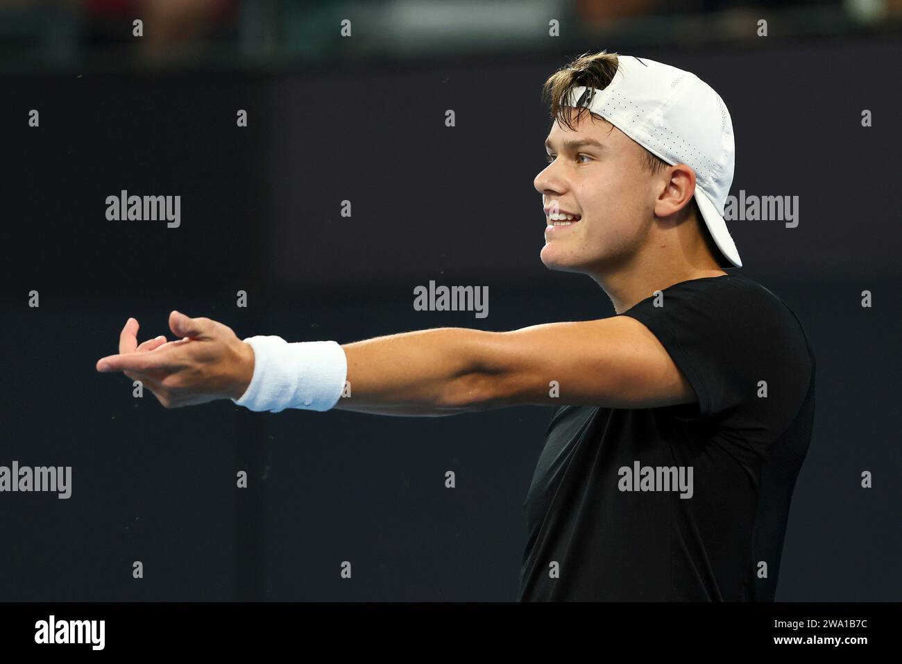 Holger Rune of Denmark reacts after missing a shot in his match against ...