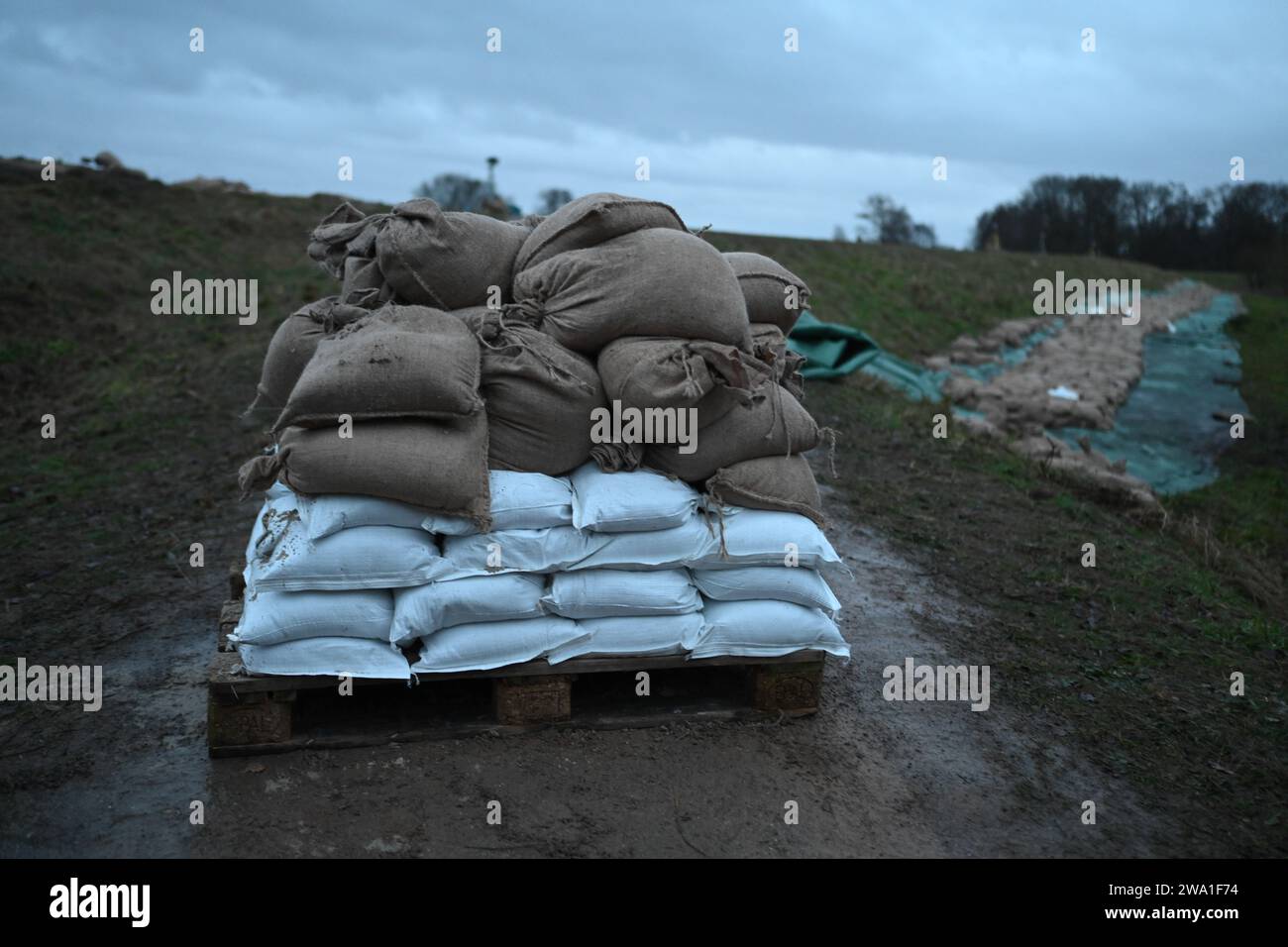 Haren, Germany. 01st Jan, 2024. A dyke on the Ems is secured with ...