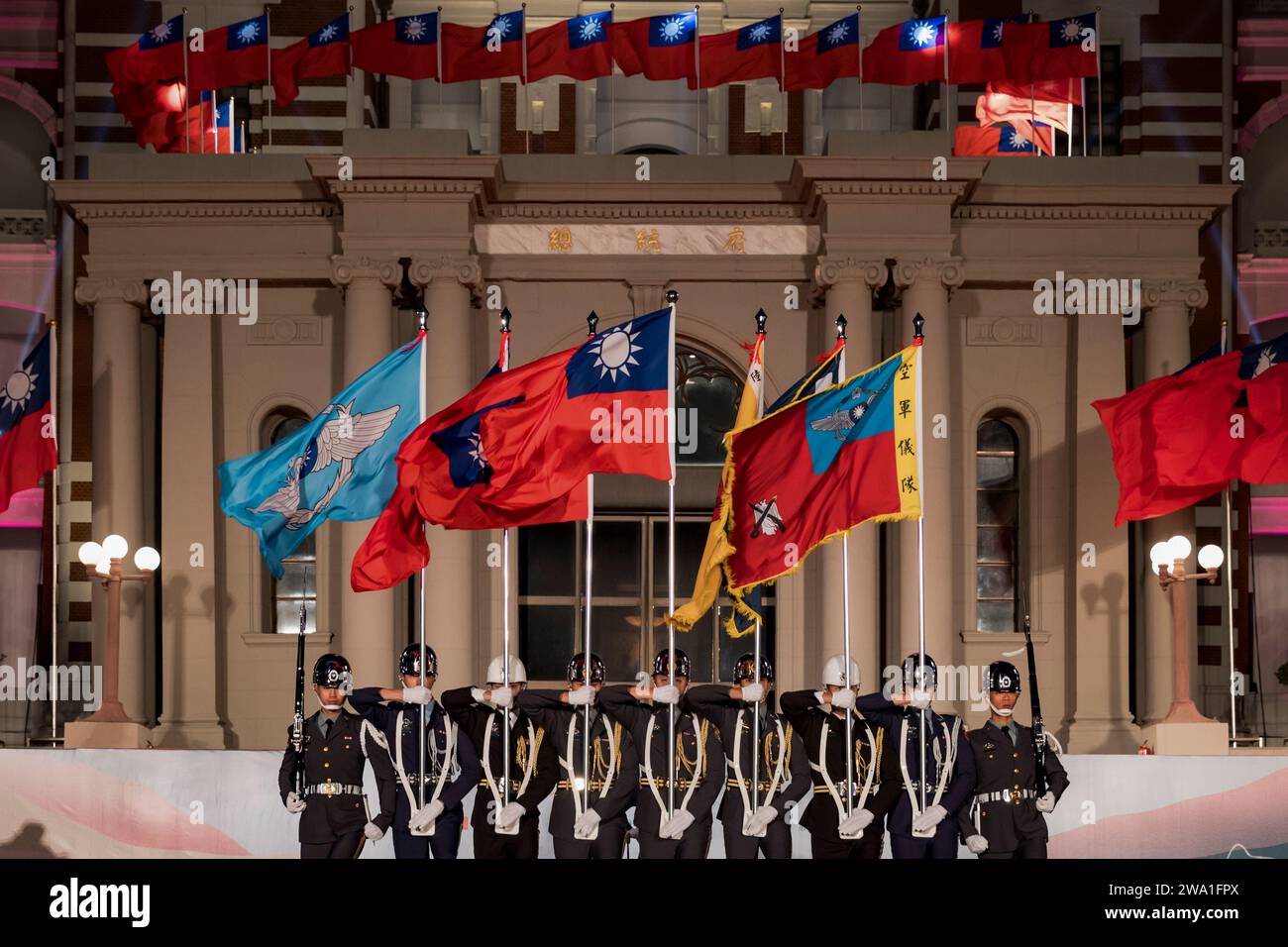 In this photo released by the Taiwan Presidential Office, soldiers hold ...