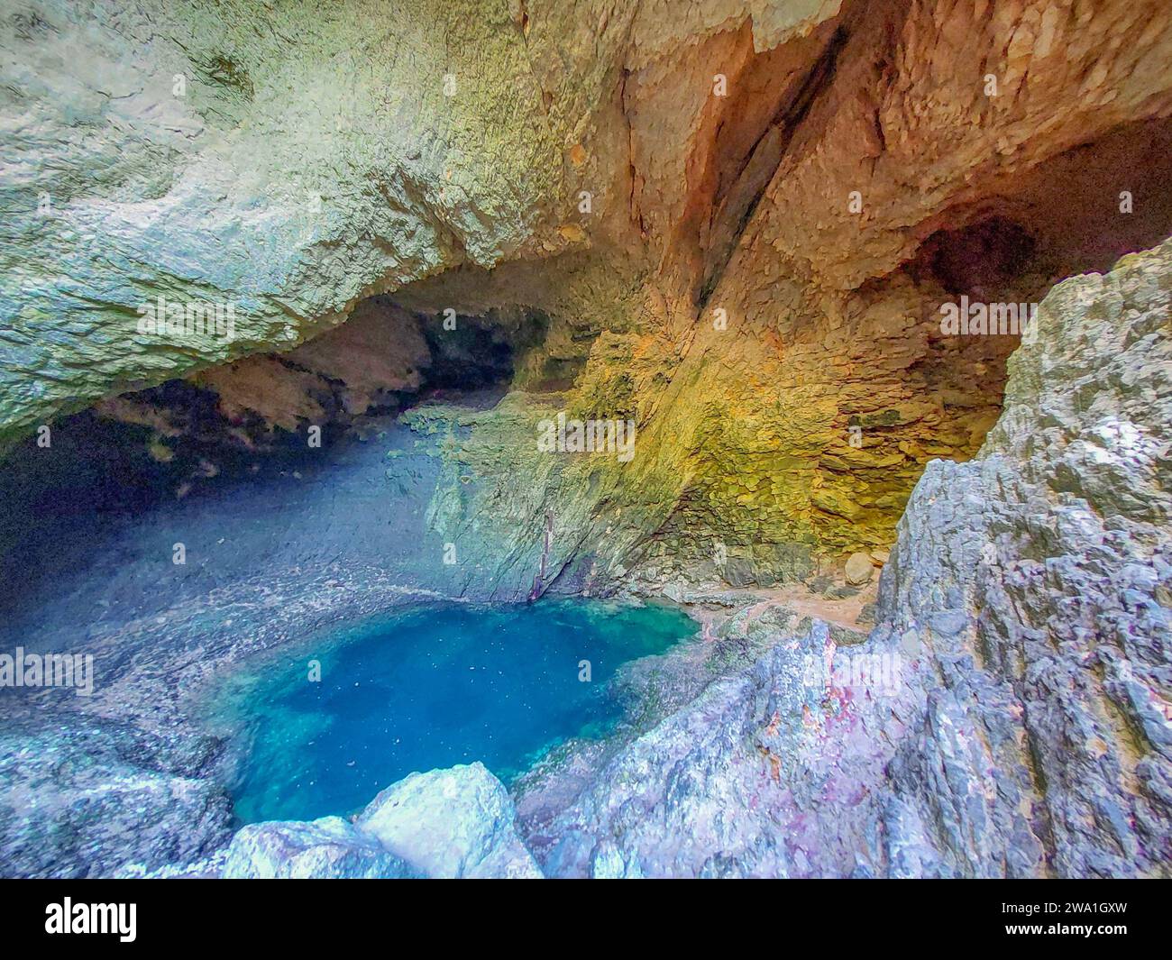 large cave full of colours, source of the Sorgue stream in Provence. It ...