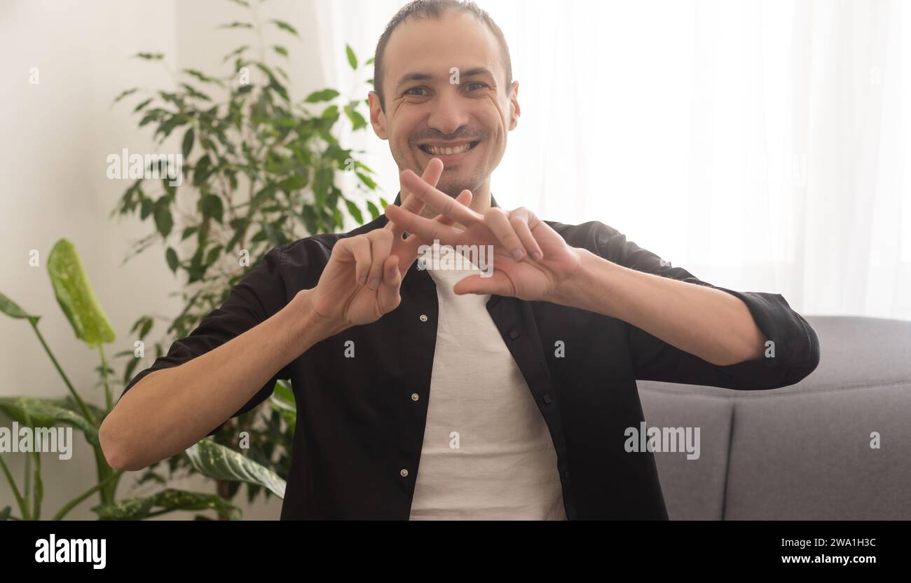 Adult Learning Sign Language For Deaf Disabled Stock Photo - Alamy