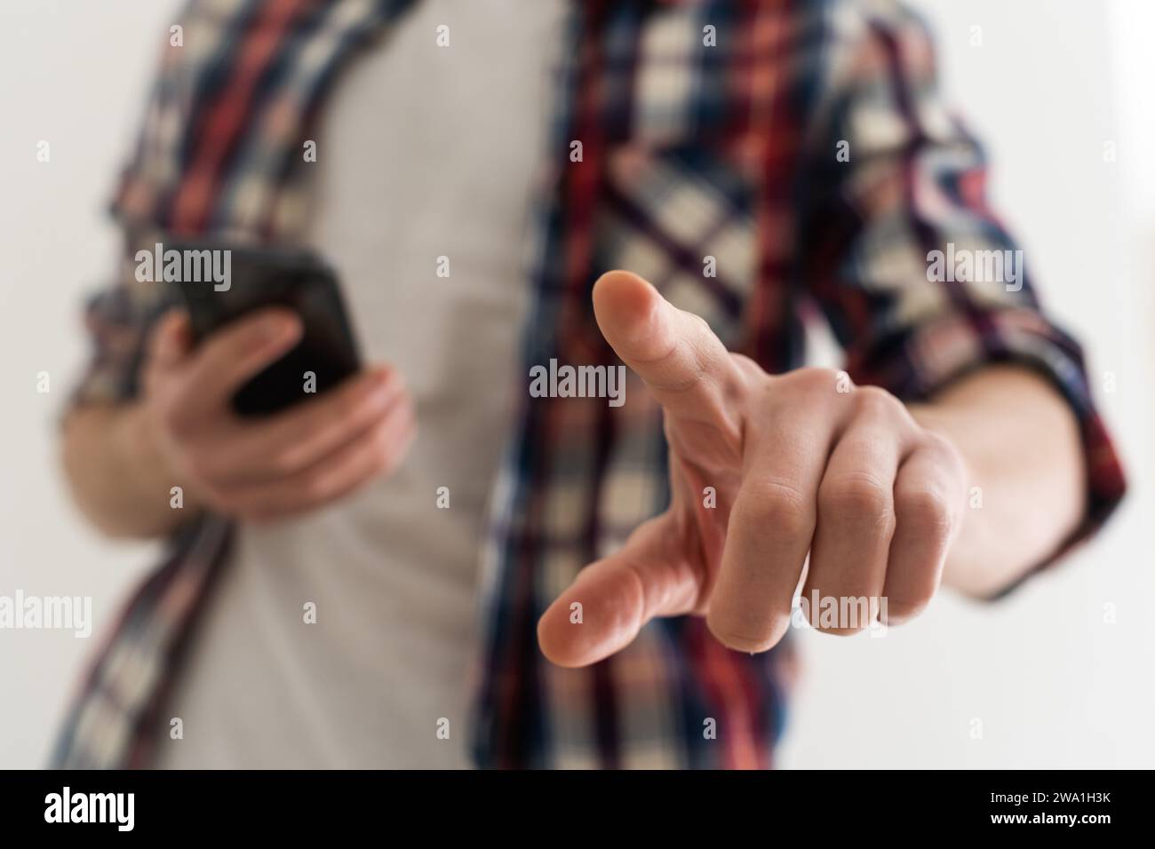Hand pointing at observer isolated on white background Stock Photo - Alamy