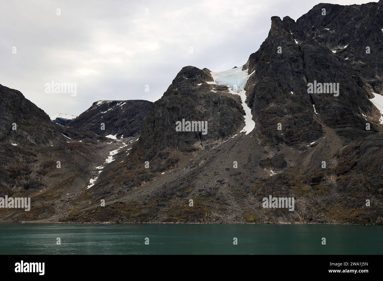 Mountain range in a bay of the Kangerlussuaq fjord Greenland, Denmark ...