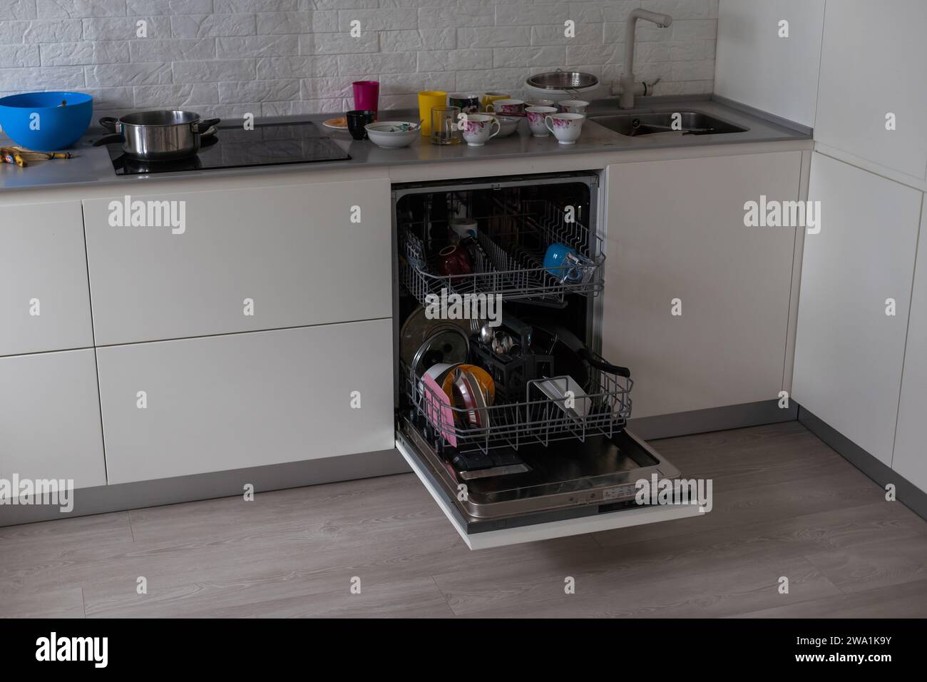 Open dishwasher with clean dishes in the white kitchen Stock Photo - Alamy