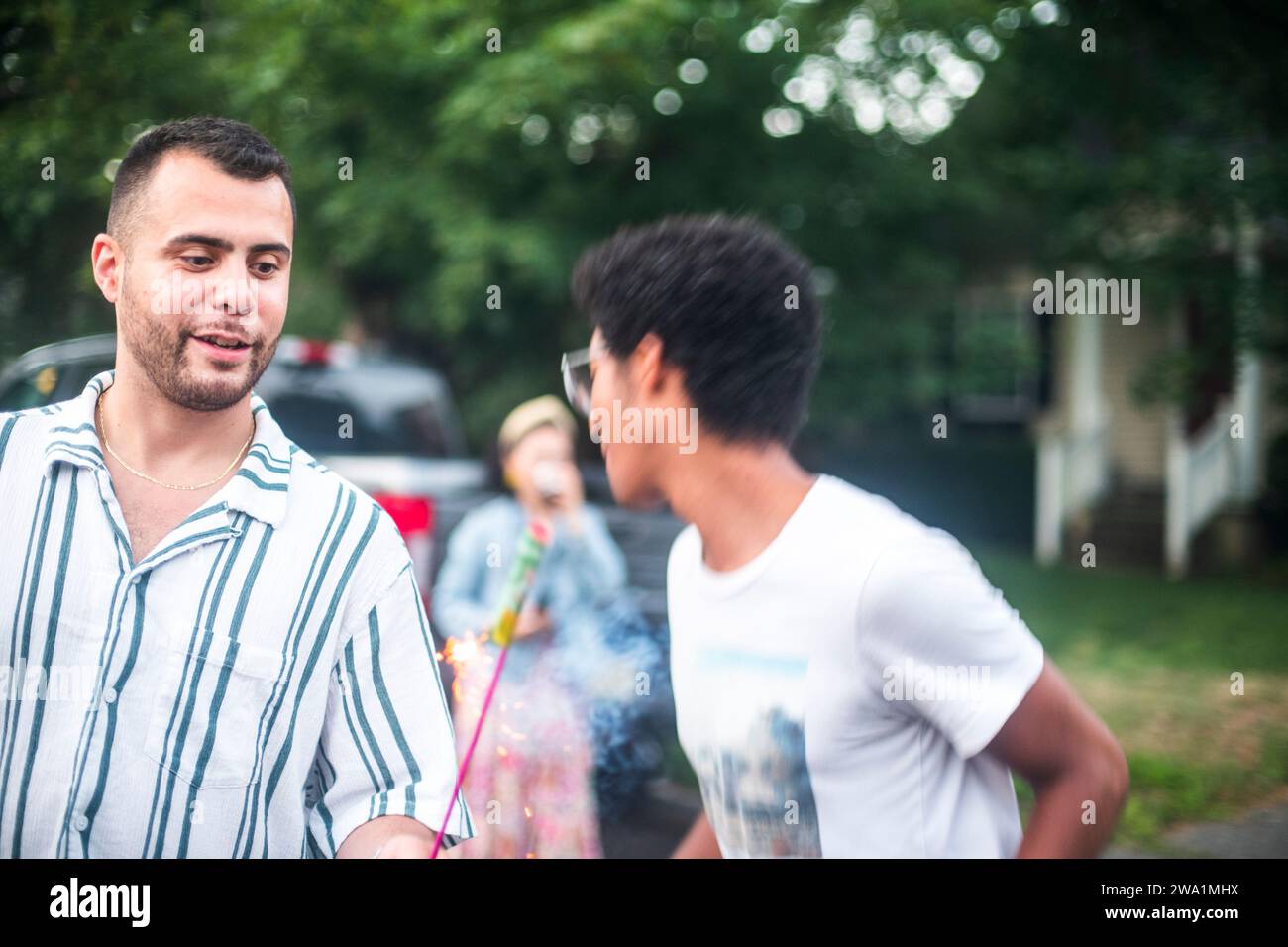 Neighbors getting together on holiday block party Stock Photo - Alamy